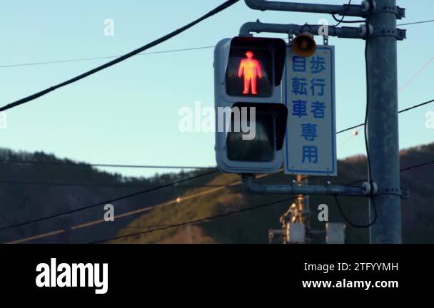 Asian pedestrian crosswalk sign at Michi road, city traffic change from ...
