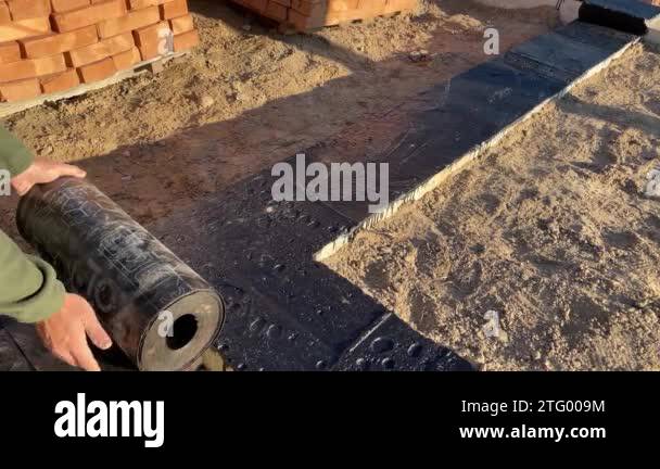 Roll waterproofing of the foundation of the building before the start ...