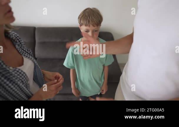 Kid son feels upset while parents fighting at background, sad little ...