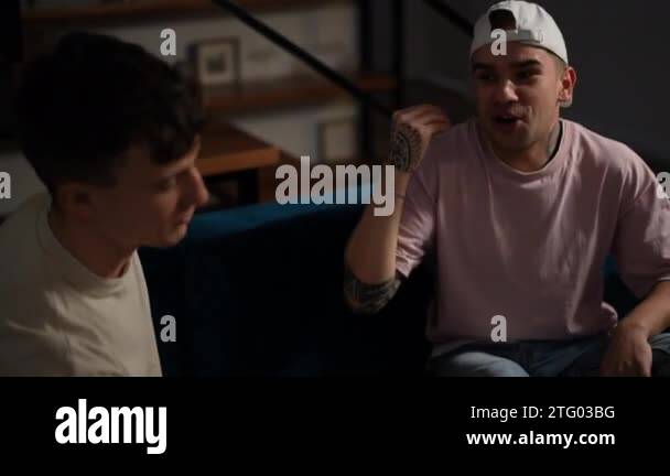 Portrait of annoyed irritated gay man shouting gesturing arguing with ...