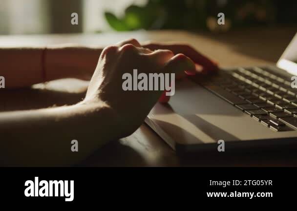 Close up woman hands entering the frame and scroll twice on the laptop ...