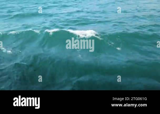 Splashing wake after a boat sailing on a beautiful sea. Boat moves ...