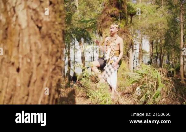 Javanese man running like chasing by someone while wearing a golden ...