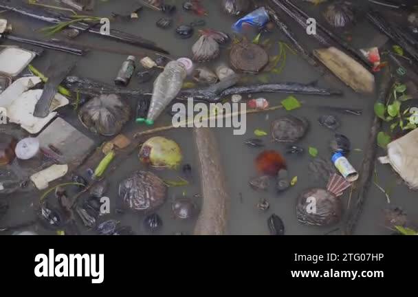 Garbage and other debris floating over water. Marine pollution. Plastic ...