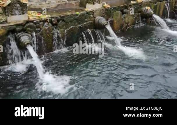 Pure holy spring water in Pura Tirta Empul Temple - 4K, Handheld Stock ...