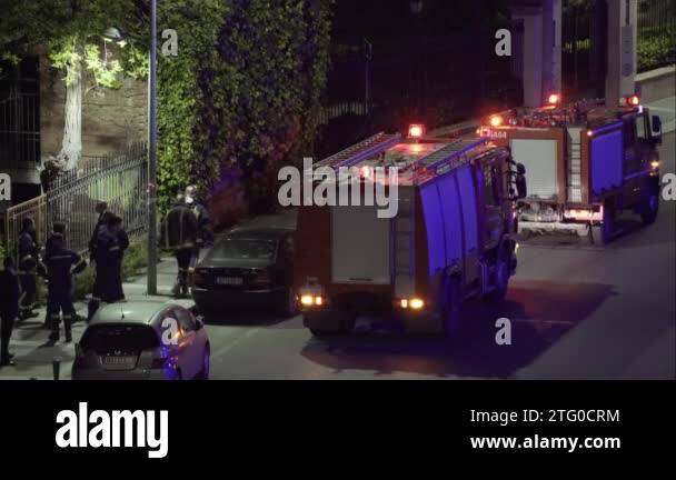 Greek Fire Brigade Service trucks with firefighters in uniform during a ...