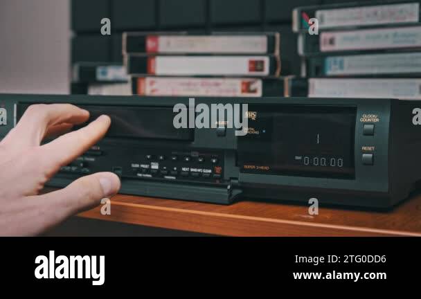 Insert VHS Cassette into VCR and Push Play Button Stock Video Footage ...