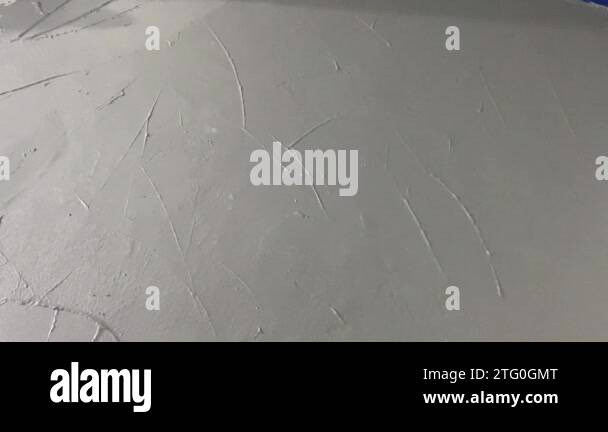 Applying a decorative microcement coating to the floor Stock Video ...