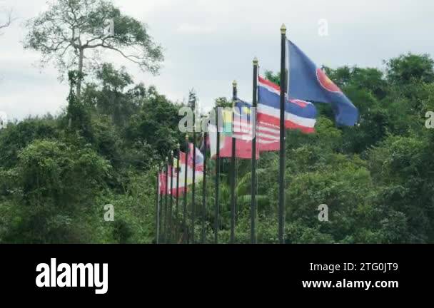 ASEAN community, a group of Southeast Asia country flags waving by the ...