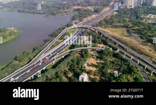 Traffic flow on a regular day over a flyover in bangalore.lake side ...