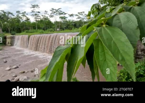 The view at a waterfall whose water is cloudy because it carries mud ...