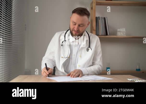 Doctor writing medical certificate Stock Videos & Footage - HD and 4K ...