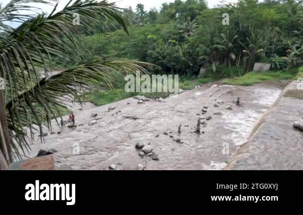 The view at a waterfall whose water is cloudy because it carries mud ...