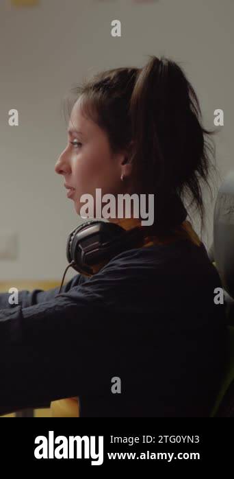Vertical video: Portrait of concentrated gamer looking at camera ...