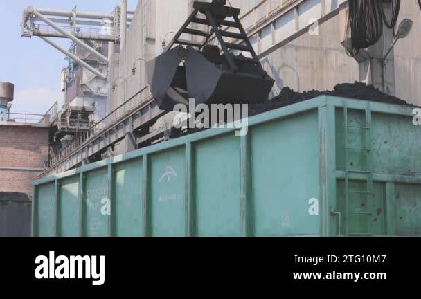 Coke coal is loaded into the wagon. Production of coking coal. Coal coking process, coke oven ...