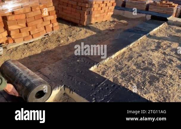 Roll waterproofing of the foundation of the building before the start ...