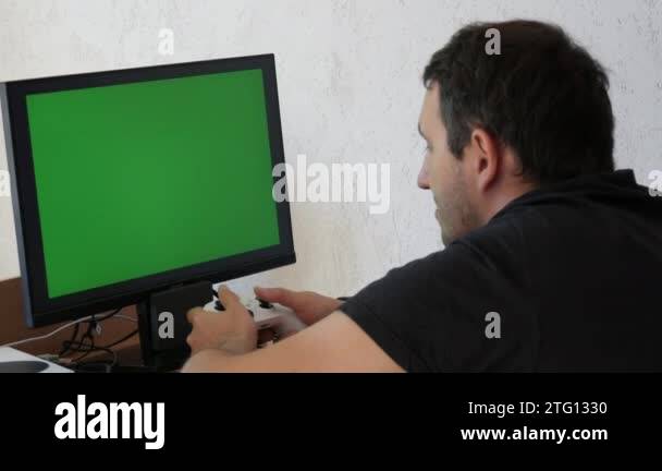 Young male gamer playing game console using joystick remote control ...