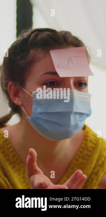 Vertical video: Happy woman gesturing playing name game with ...