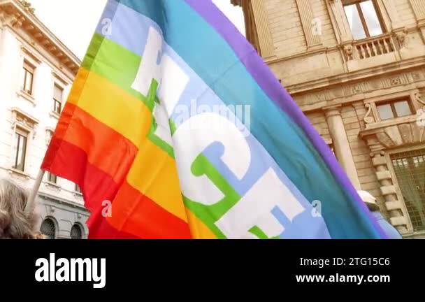 People with peace rainbow flags waving in slow motion at a ...