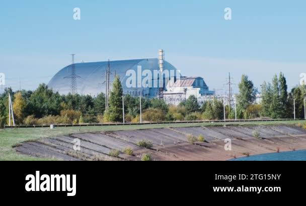 Sarcophagus Chernobyl, fourth reactor, shelter. Metal hangar, road past ...