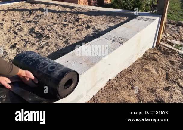 Roll waterproofing of the foundation of the building before the start ...
