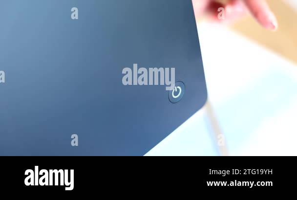 Woman hand touching power button. Control turning TV monitor on or off ...