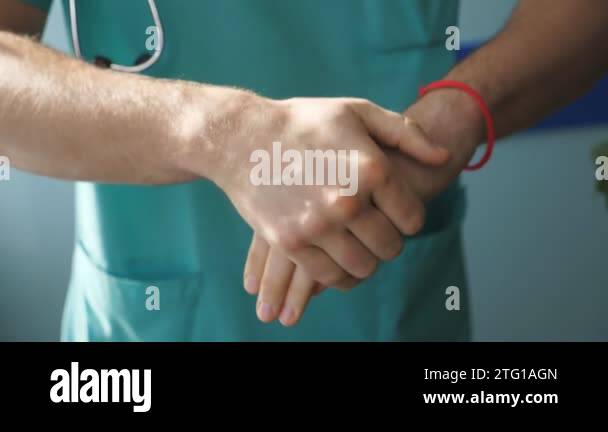Doctor applies disinfectant on his hands. Medic inflicted on arm ...
