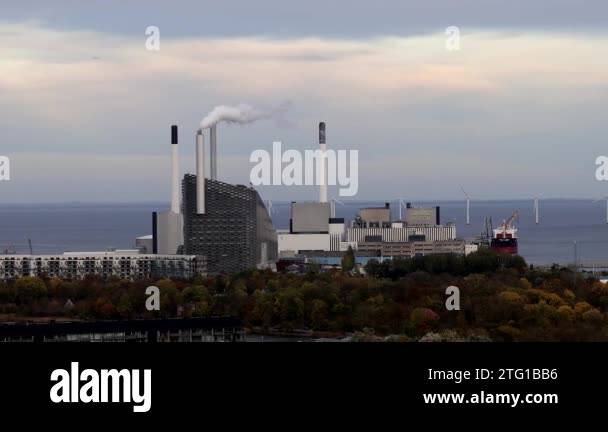 Copenhagen, Denmark The CopenHill power plant and wind turbines in the ...