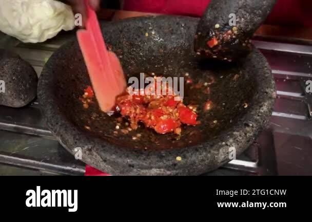 Fried red chili to make chili sauce. Sambal is one of the traditional ...