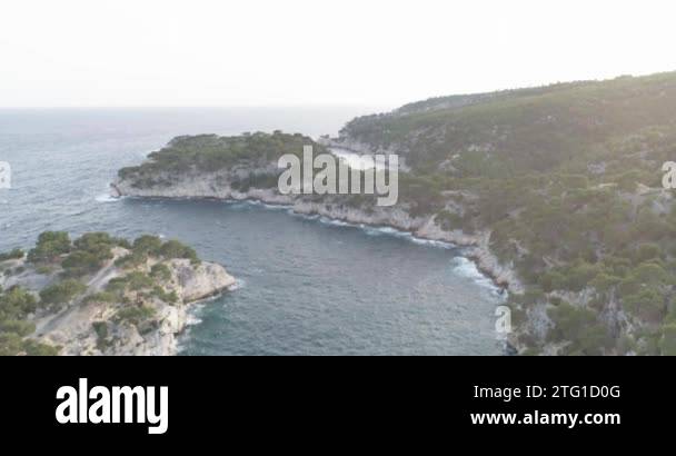 Wide, Aerial Clip over the Scenic Beachs of Calanques de Port Pin, near ...