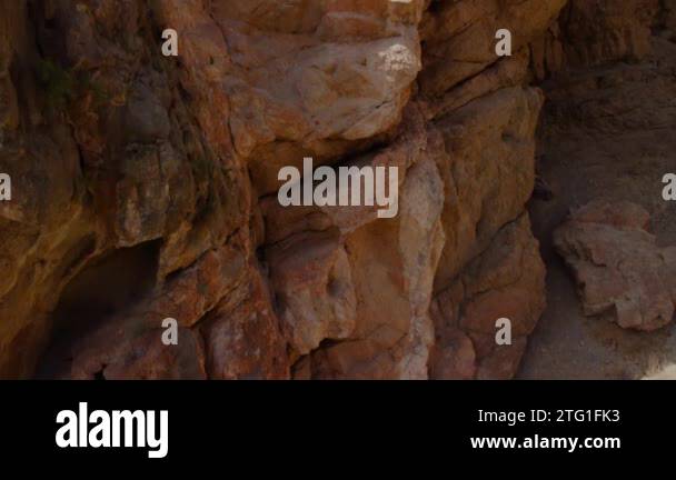 via ferrata. Man climbing mountain by the cleats of a via ferrata ...