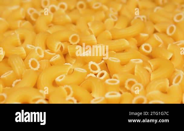 Uncooked Chifferi Rigati Pasta Rotating. Fat and Unhealthy Food ...