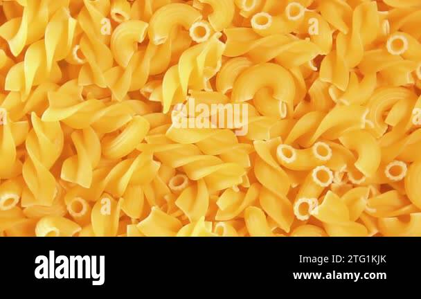 Uncooked Fusilli and Chifferi Rigati Pasta - Top View. Fat and ...