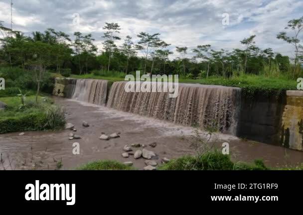 The view at a waterfall whose water is cloudy because it carries mud ...