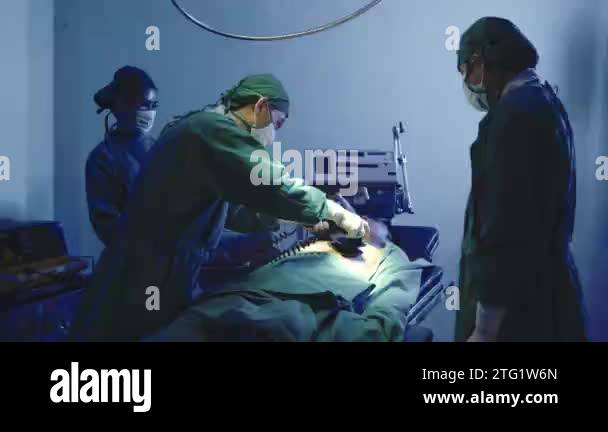 Defibrillation cardiac dysrhythmia, Surgical doctor team performing ...