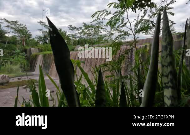 The view at a waterfall whose water is cloudy because it carries mud ...