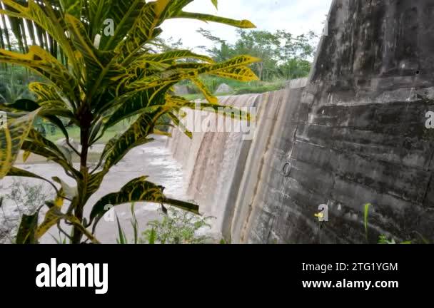 The view at a waterfall whose water is cloudy because it carries mud ...