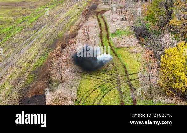 The explosion of a shell or mine on a country road. After the explosion ...