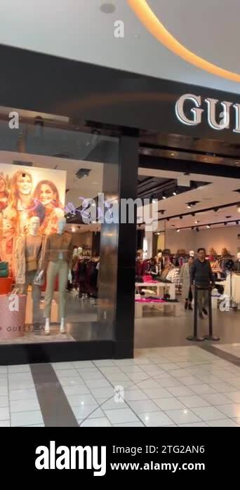 Guess Clothing store Shoes and jewelry showcase shop entrance Guildford ...