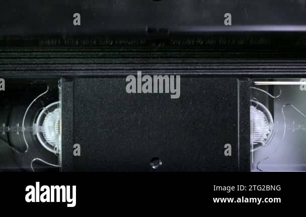 Inserting a VHS Tape into a VCR Player and showing how it works Stock ...