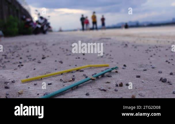Single use plastic pollution discarded drinking straw Stock Video ...