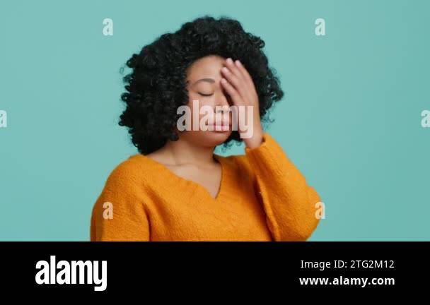 Upset Worried Curly Hair Woman Slapping Hand On Face And Expressing