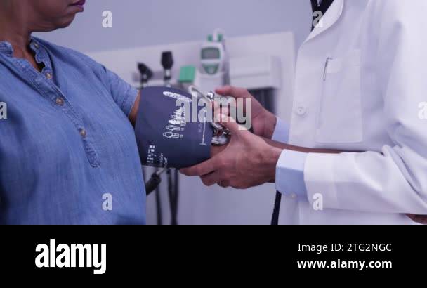 Close up of medical doctor using stethoscope to check senior patients ...