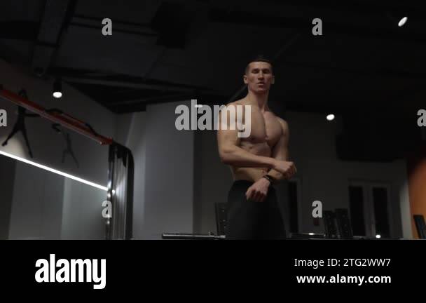 bodybuilder pose in sport gym. sport bodybuilder with bodybuilding pose ...