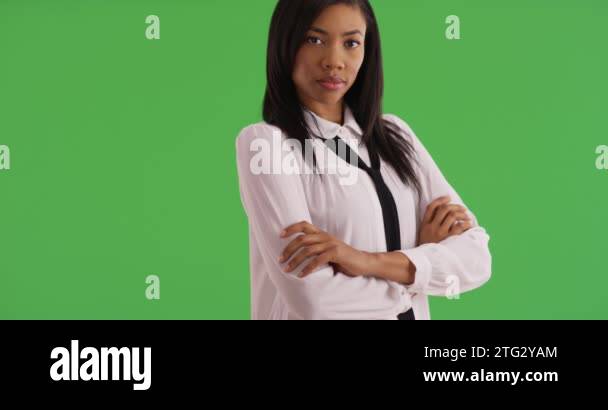 Confident African American professional woman with arms crossed on ...