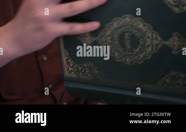 Open the Quran in your hand and start reading it, turn the pages of the ...
