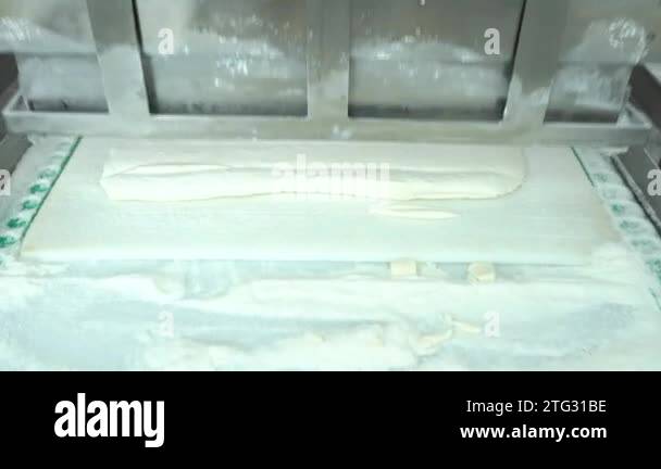 View of an automated factory machine slicing squares of Turkish Delight ...