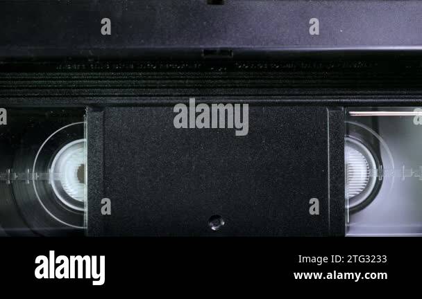 Playing a VHS Tape into a VCR Player Stock Video Footage - Alamy
