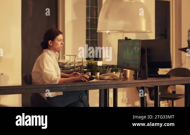 Freelancer working with charts and graphs on computer, analyzing ...