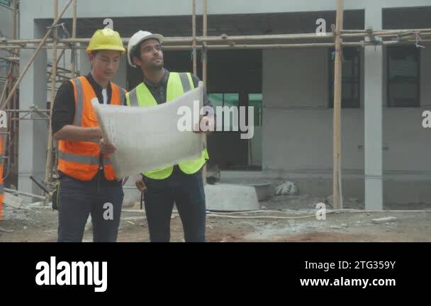 Team group of contractor and architect with foreman explaining about scheme building site for ...